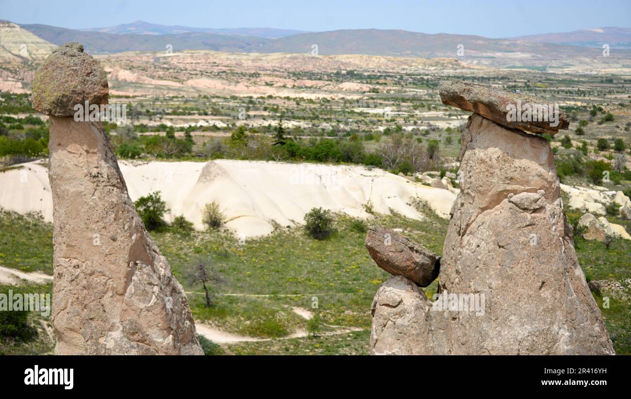 Goreme, positioned between the rock formations called fairy chimneys ...