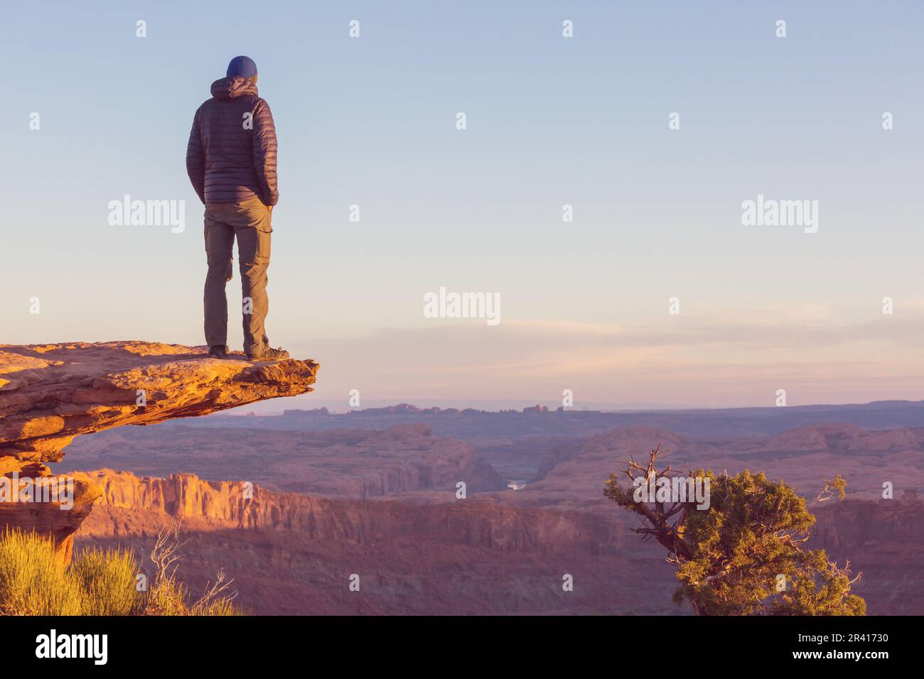 Man on the cliff Stock Photo - Alamy