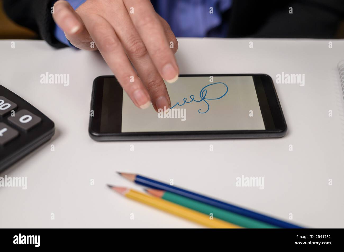 Signing for delivery on electronic device hi-res stock photography and ...