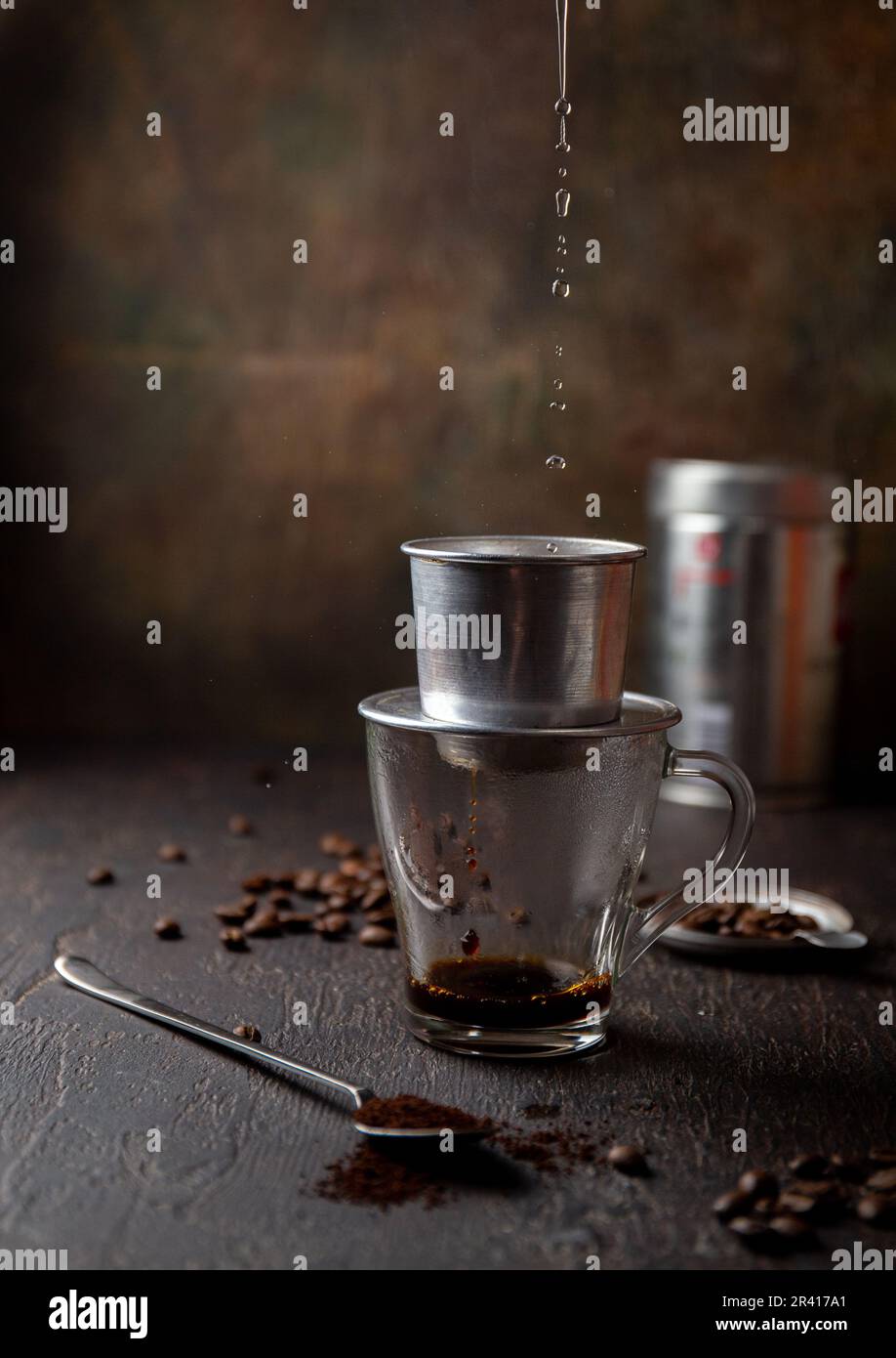 Preparation of Vietnamese coffe with aluminum cofe filer on dark ...