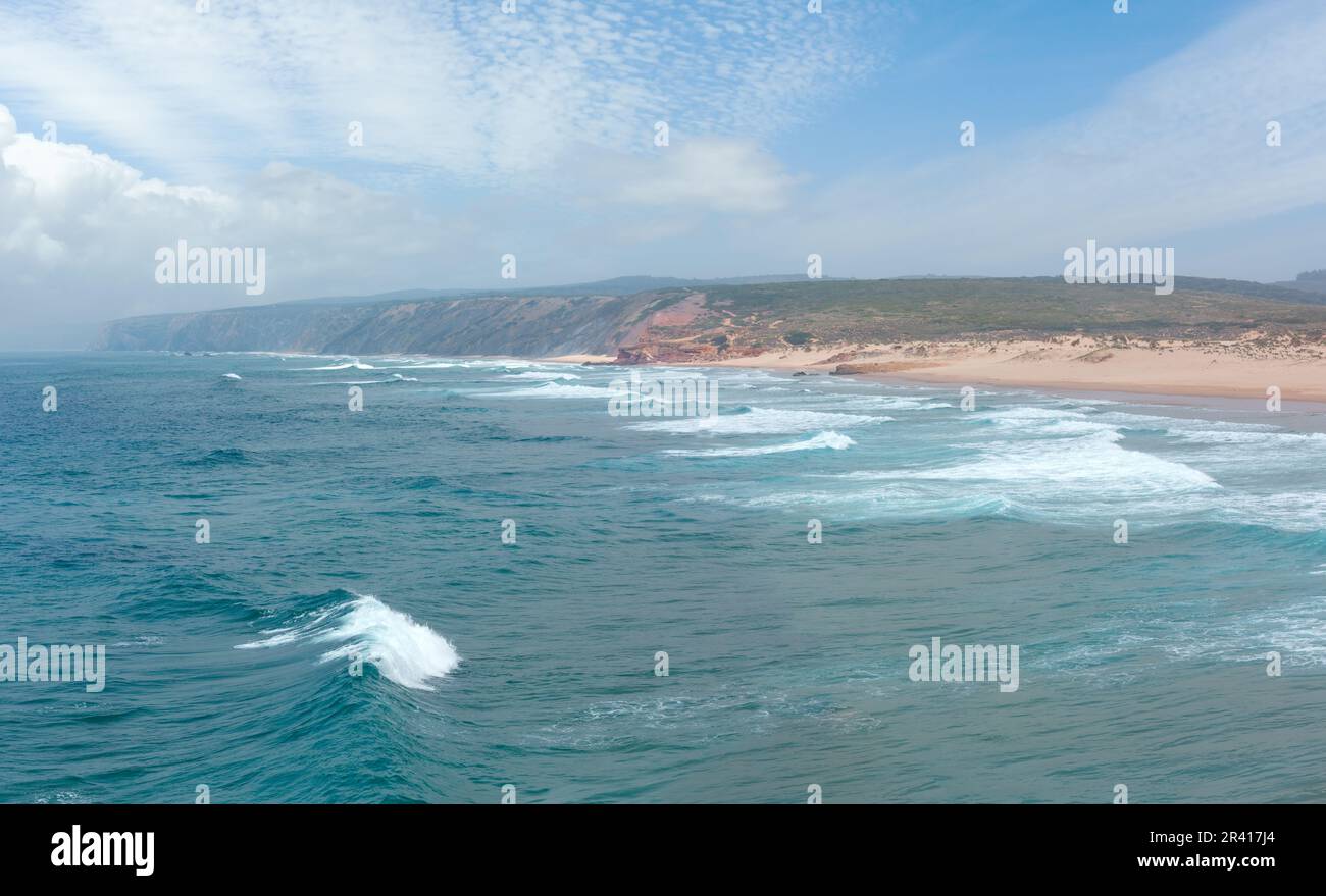 Summer Atlantic coast and sandy beach Praia da Bordeira. Misty view ...