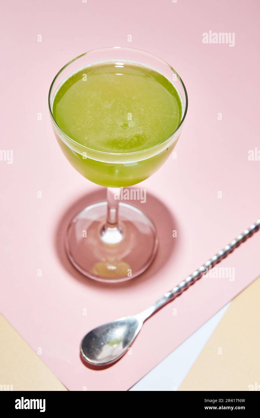 Cold alcoholic or non-alcoholic cocktail on pastel background. Hard ...