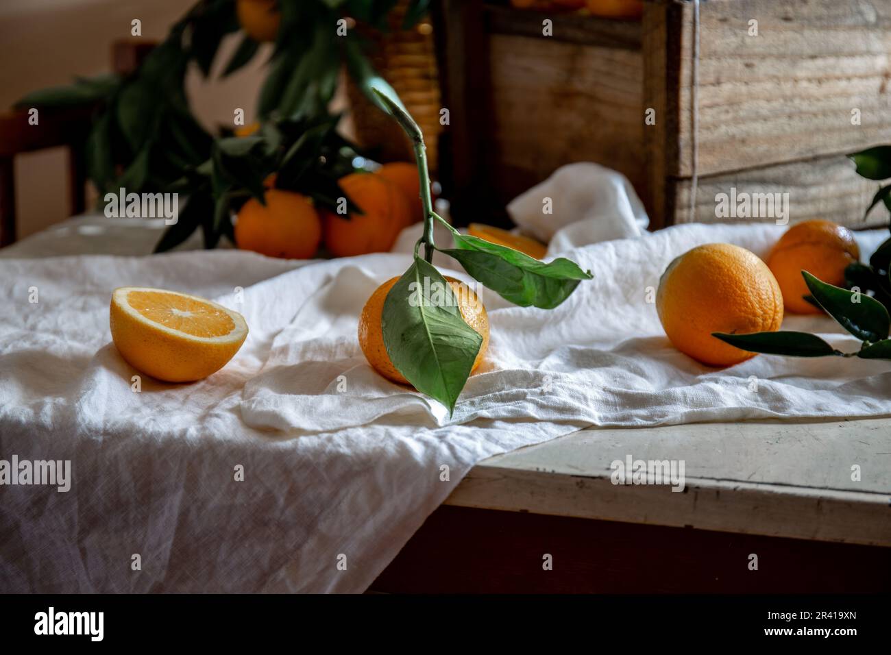 Table with box of fresh orange with orange tree branch and fresh orange ...