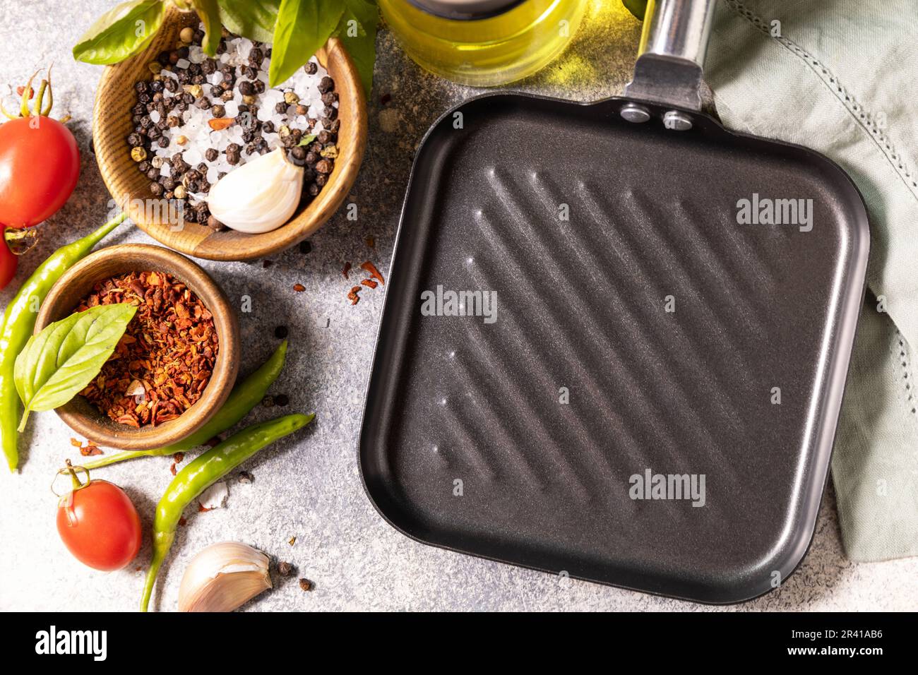 Food cooking background on gray background with grill pan. Empty grill ...