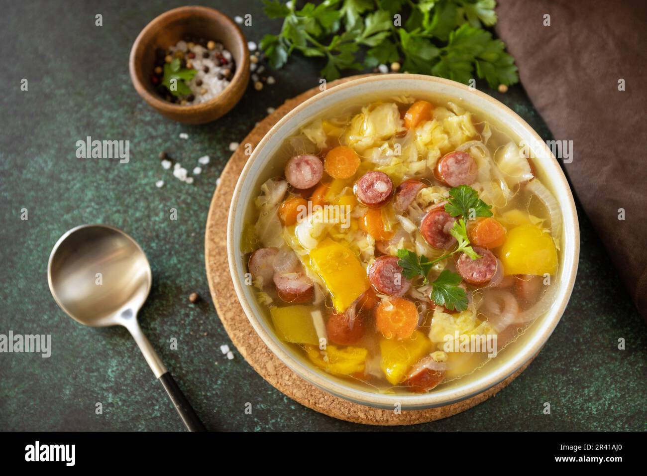 Traditional Zelnacka cabbage soup with sausages and vegetables in a ...