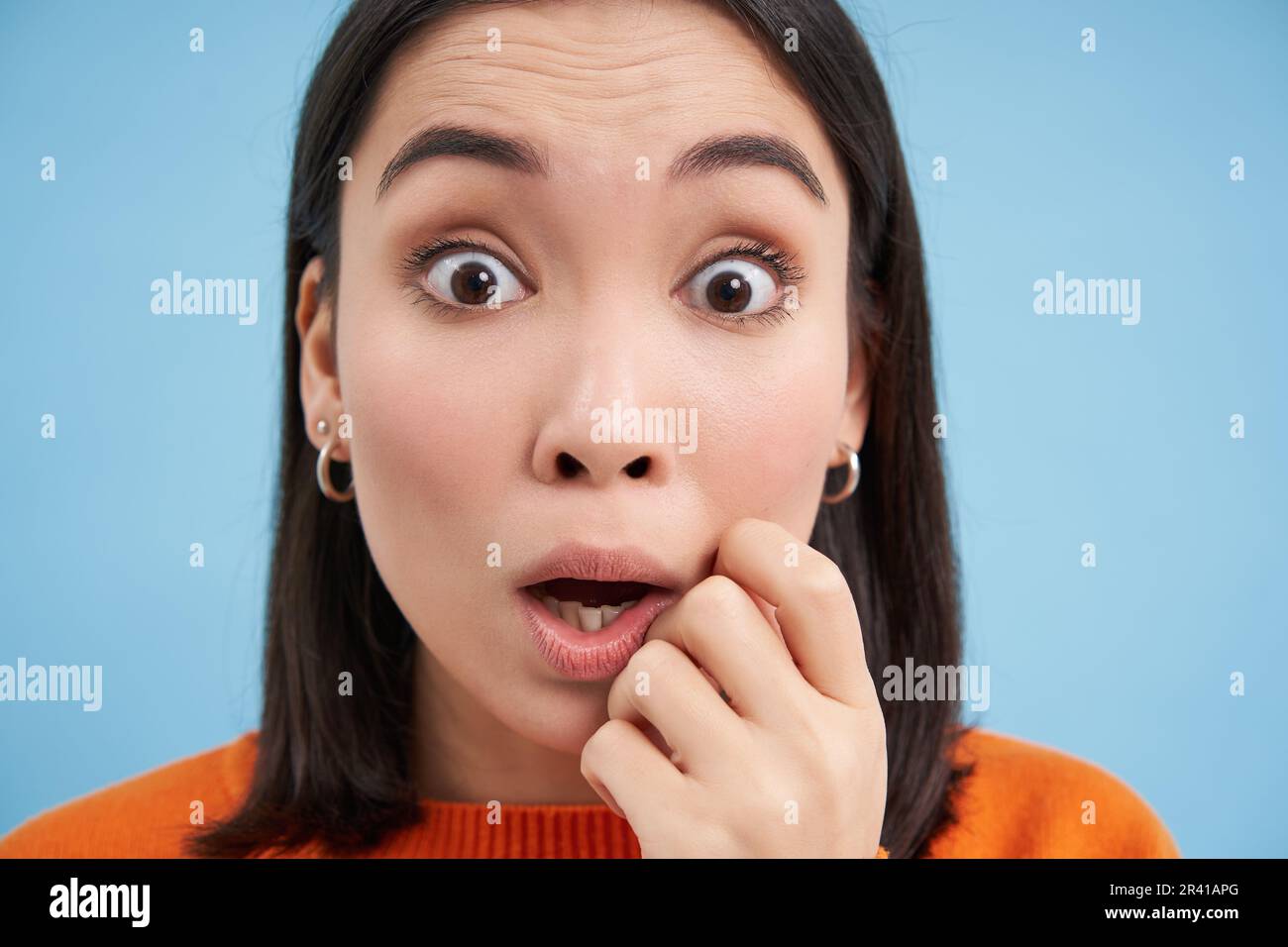 Close Up Portrait Of Amazed Asian Girl Looks With Interest Listens To