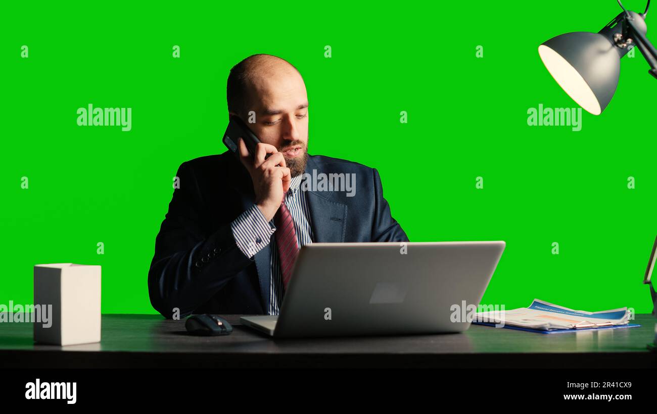 Office employee answering phone call on green screen Stock Photo - Alamy