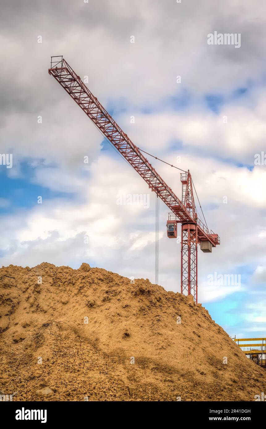 Construction site with crane. Crane on construction side against a ...