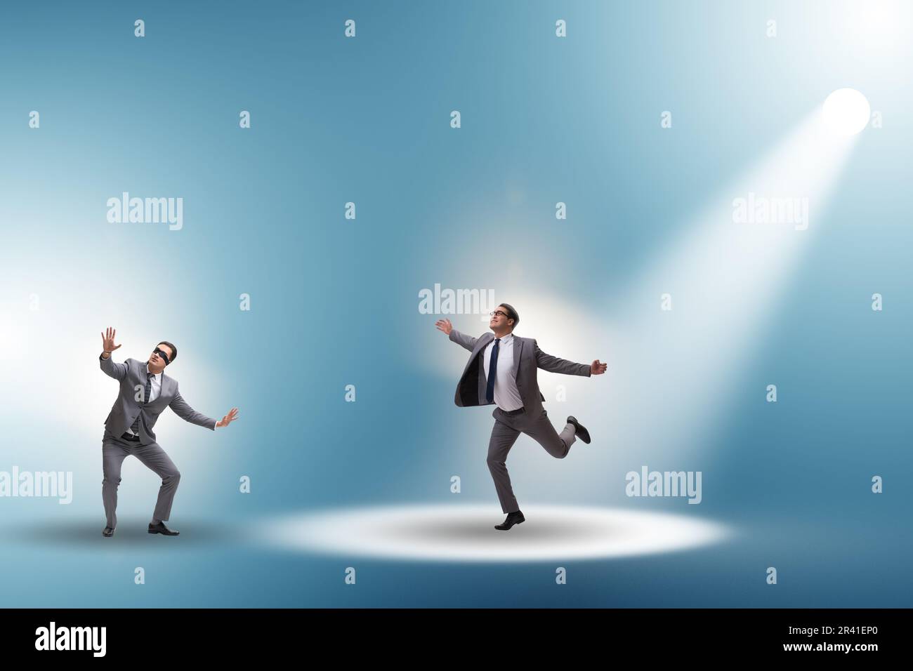 Business people under the spotlight Stock Photo - Alamy