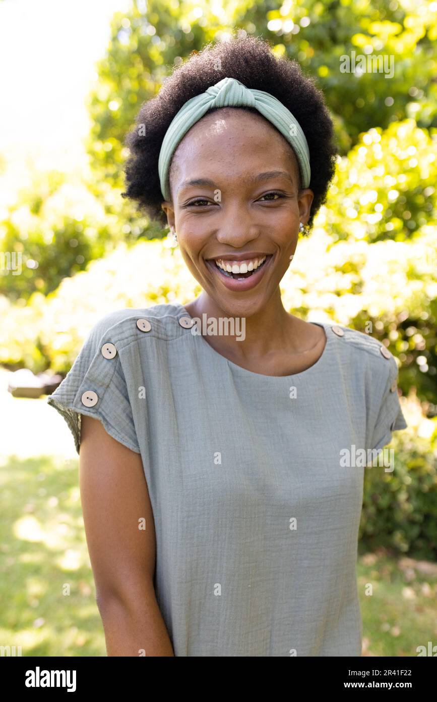 Portrait of happy african american mid adult woman with short afro hair ...