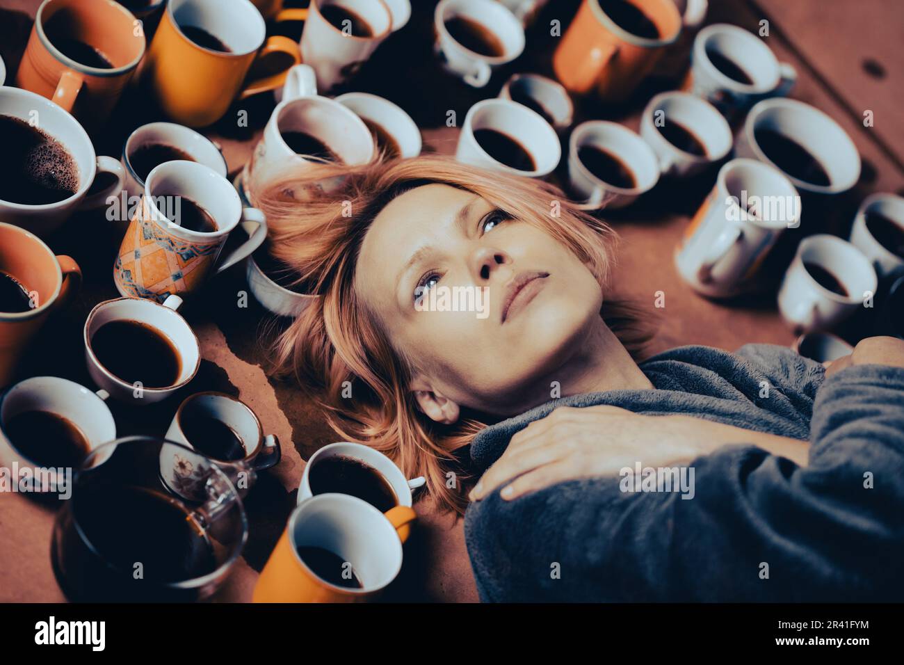 Person surrounded by coffee cups hi-res stock photography and images ...