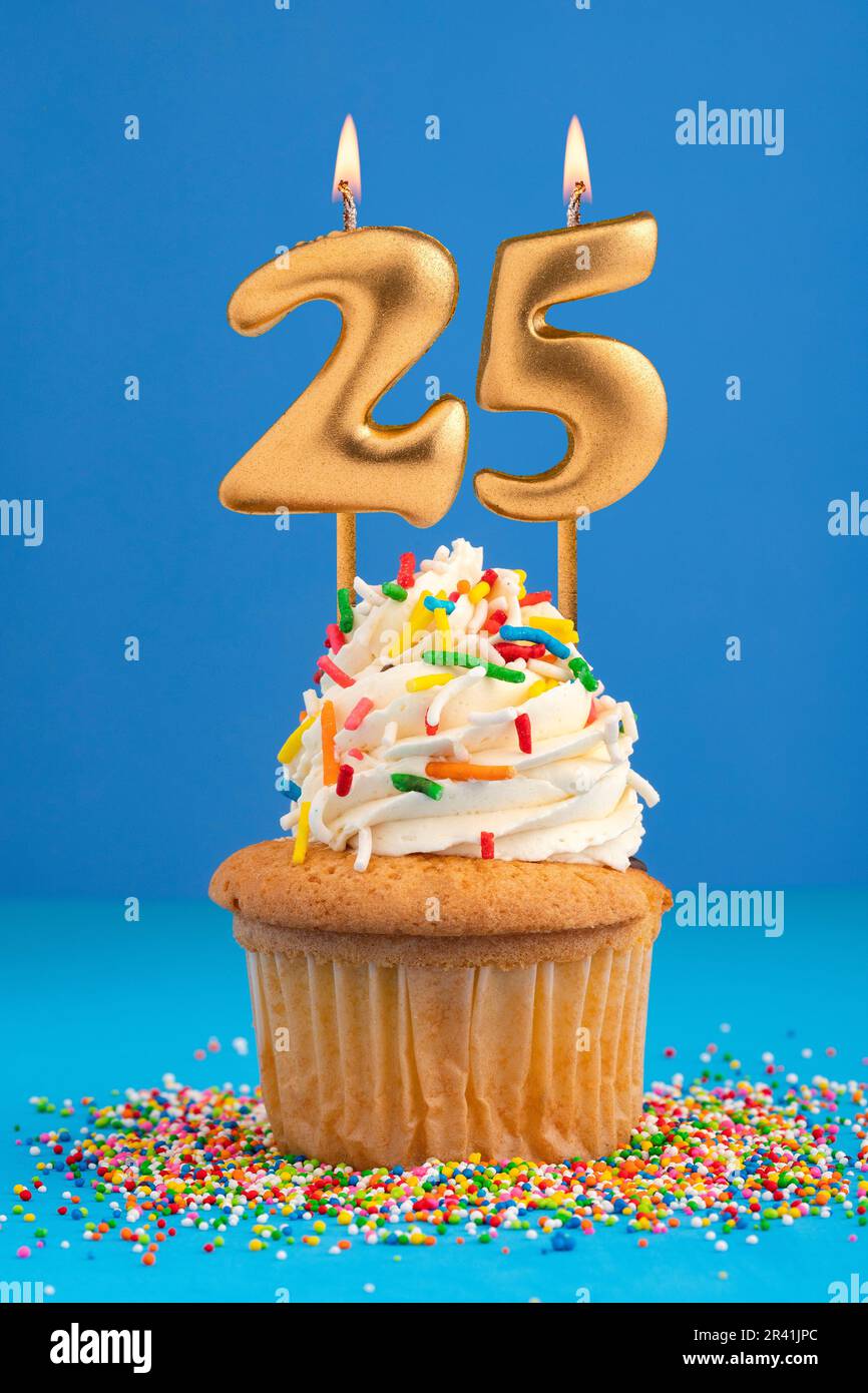 Candle number 25 - Cake birthday in blue background Stock Photo - Alamy