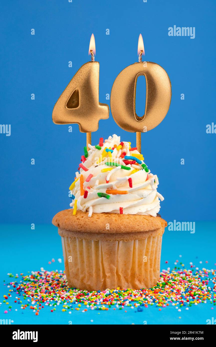 Birthday cake with candle number 40 - Blue background Stock Photo - Alamy