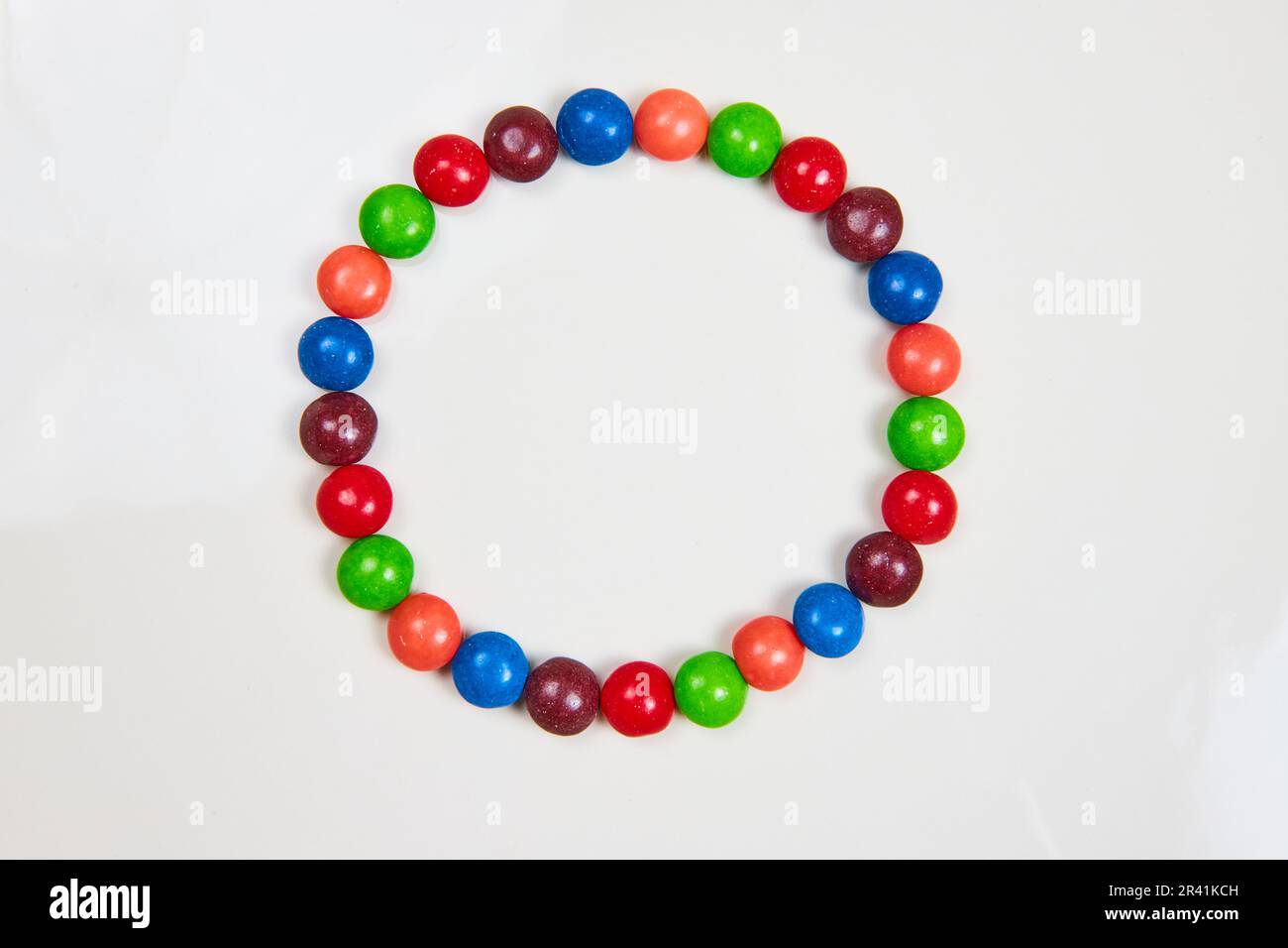 Skittles sugar candy in a circle with variety of colors from red and ...