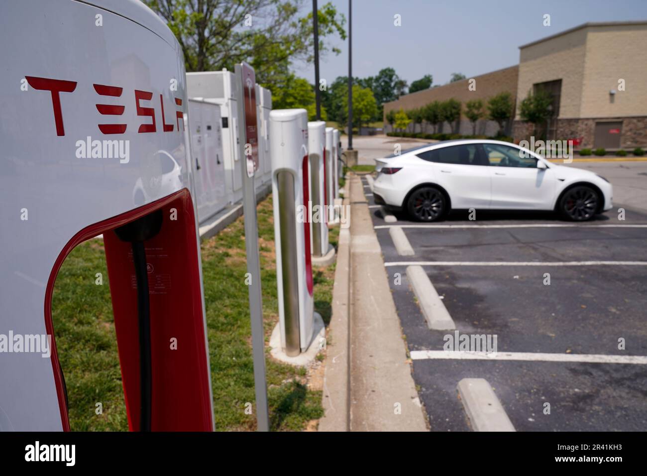 A Tesla electronic vehicle is charged at a Tesla charging station ...