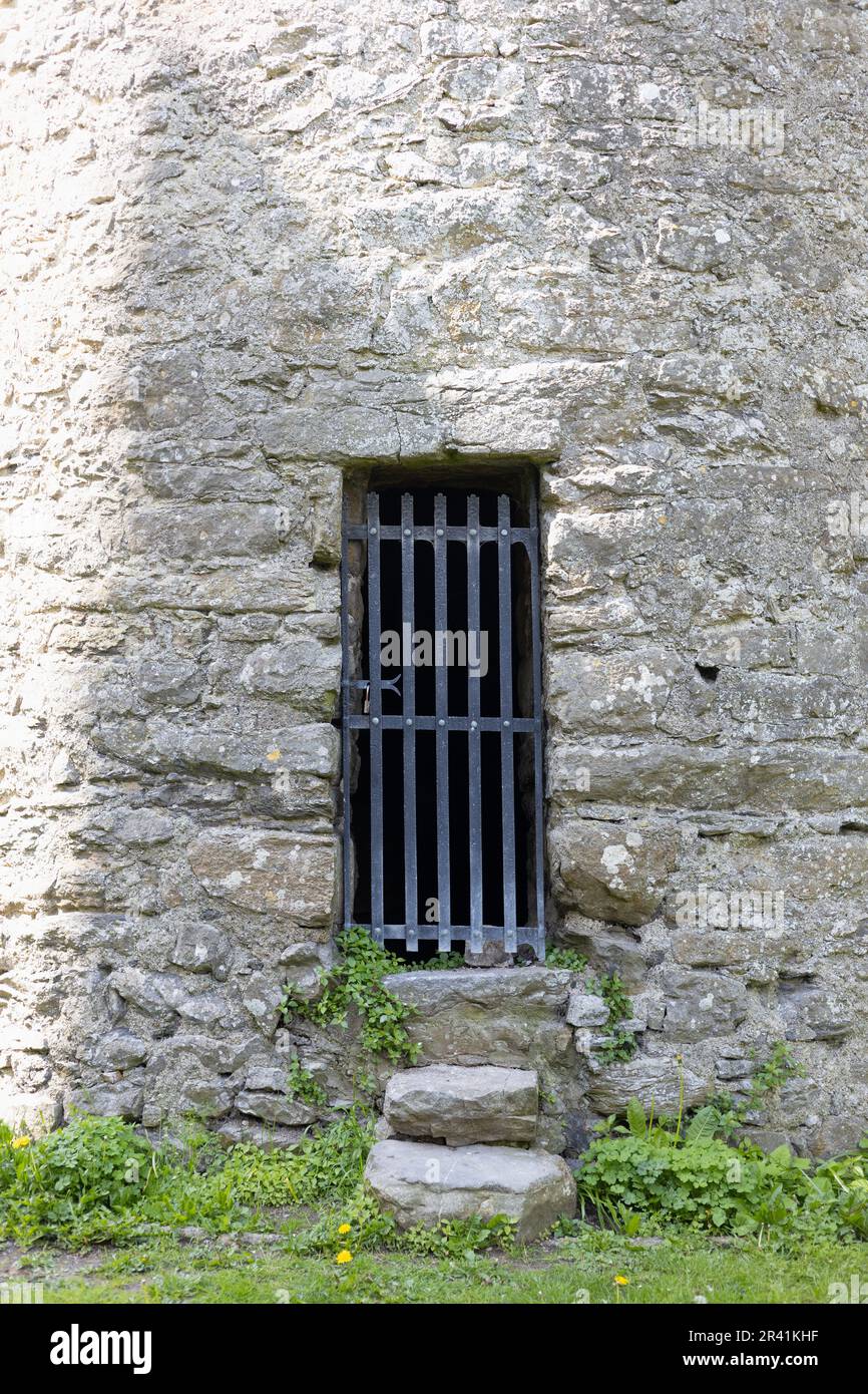 A door with bars on the Swords Round Tower in Swords, Ireland Stock ...