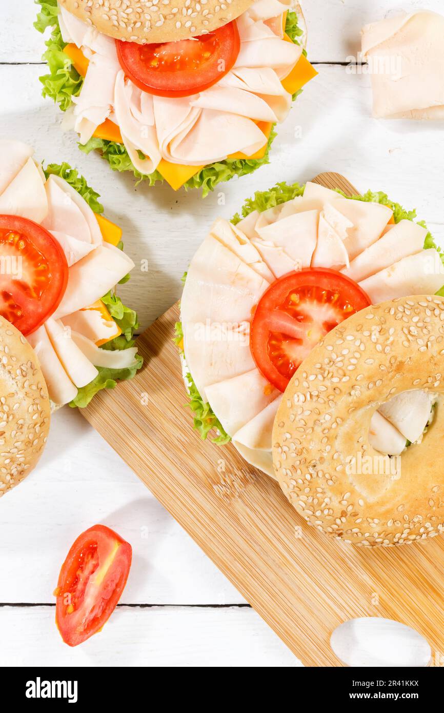 Bagel roll sandwich for breakfast topped with chicken ham from above ...