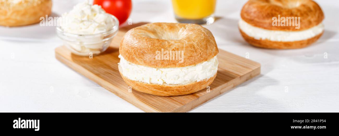 Bagel roll sandwich for breakfast topped with cream cheese Panorama in ...