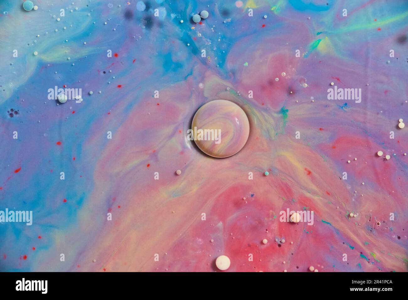 Colorful planetary orb abstract space art from oil and milk background ...