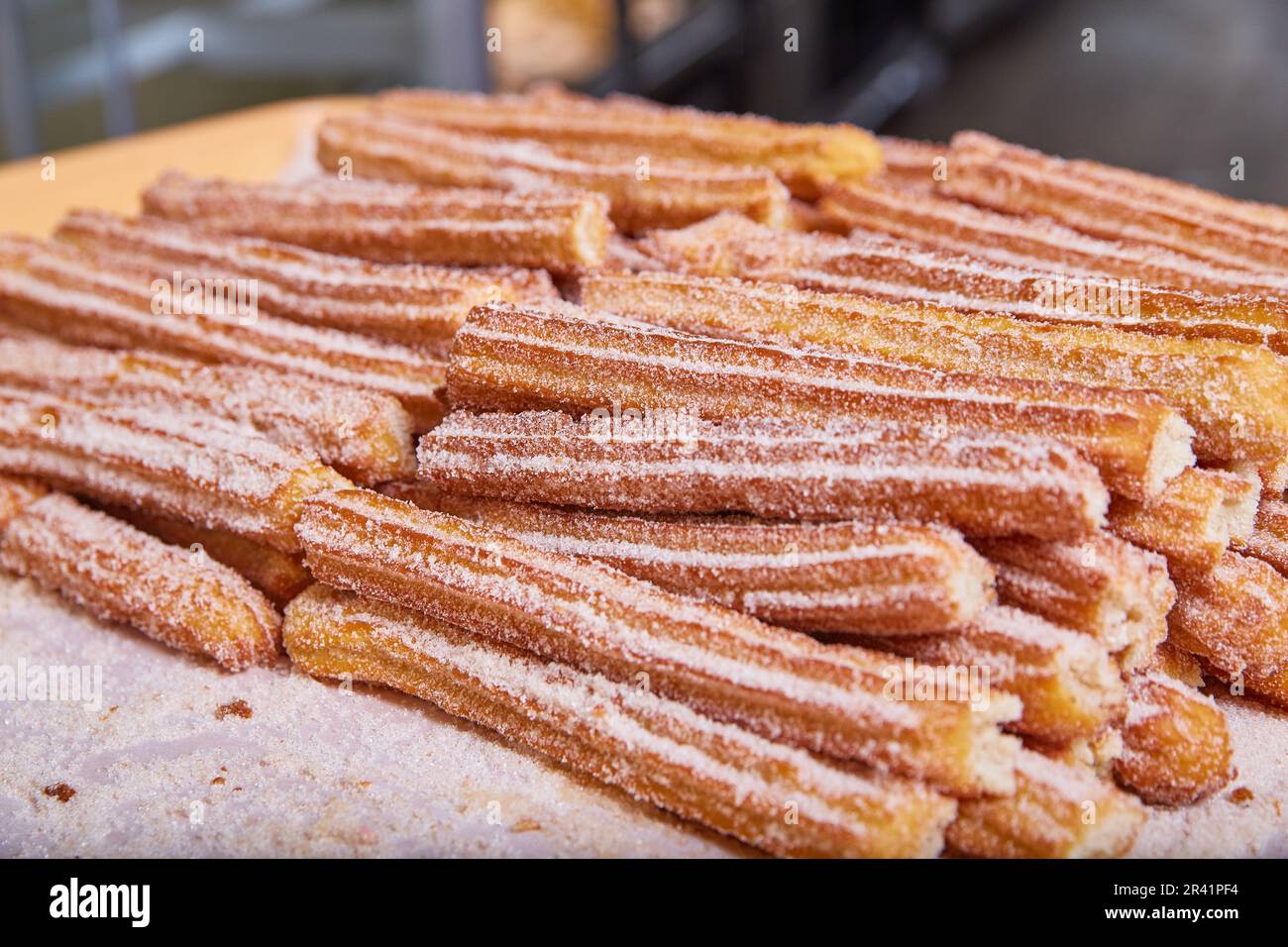 Tray of churros a star-shaped Mexican baked good pastry coated in ...