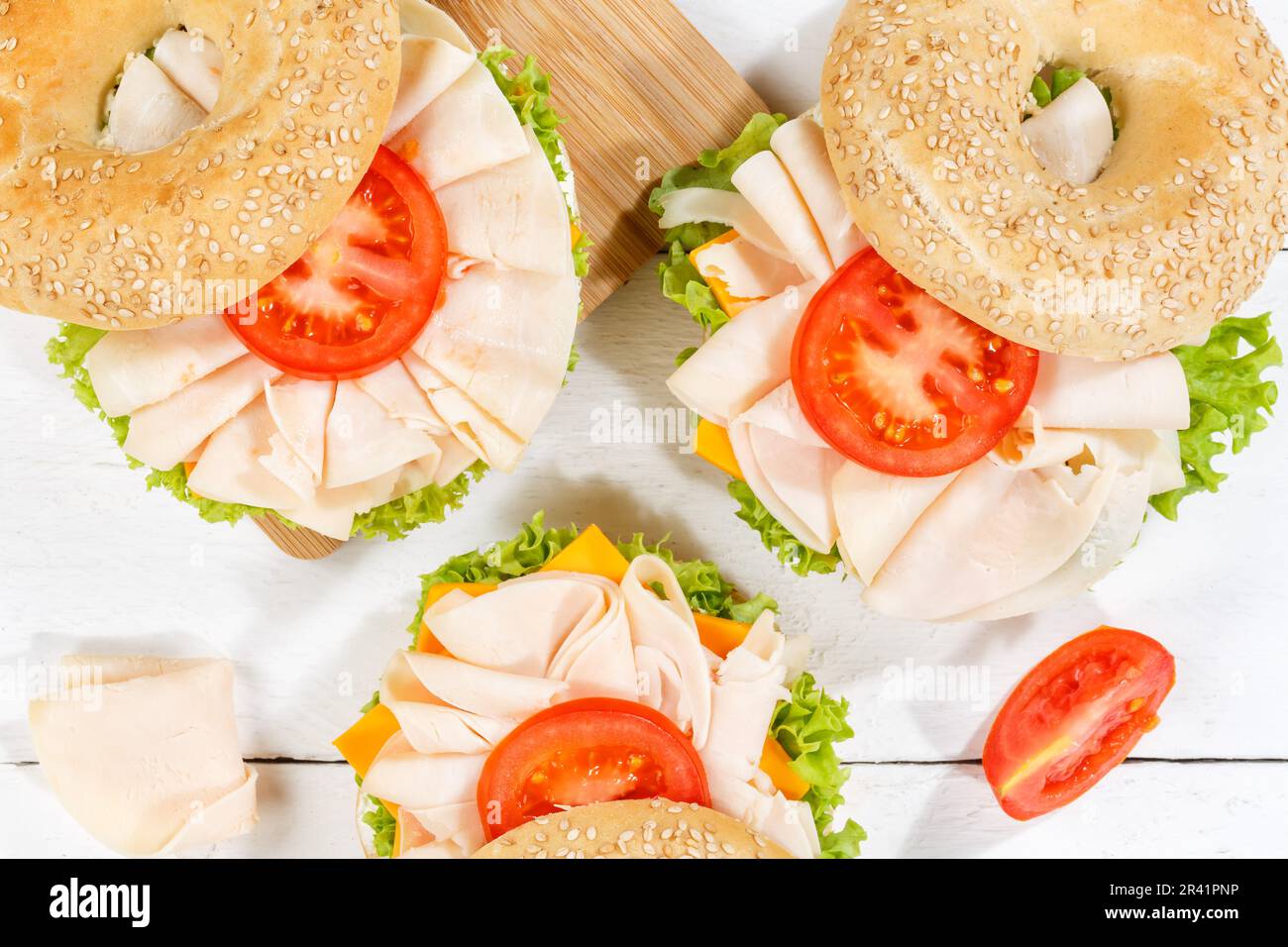 Bagel sandwich for breakfast topped with chicken ham from above in ...