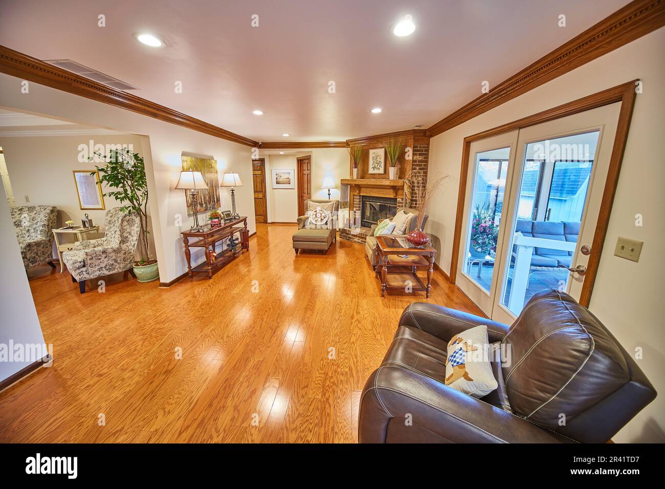 Floor model home interior design leather chair wood flooring bright ...