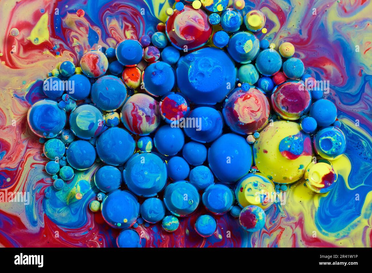 Many blue oil bubbles vibrant abstract colors swimming in sea of red ...