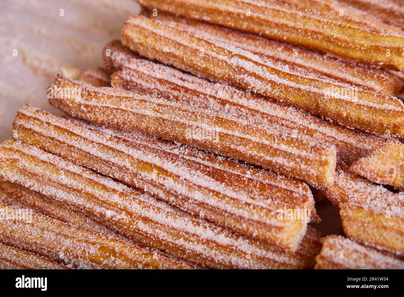 Wall of churros a star-shaped Mexican baked pastry coated in cinnamon ...