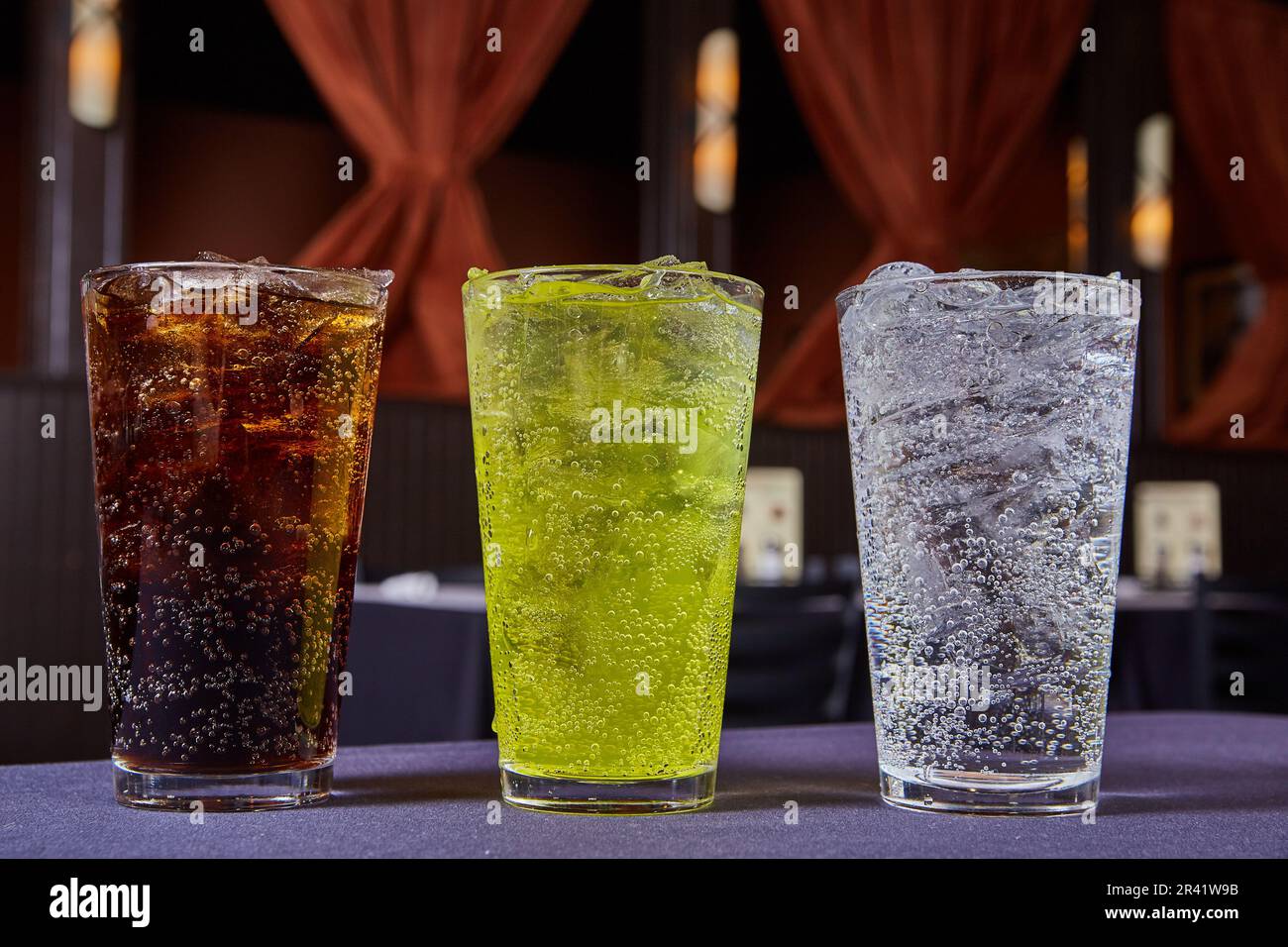 Coke or Pepsi soft drinks dark brown, lime green, clear bubbly soda ...