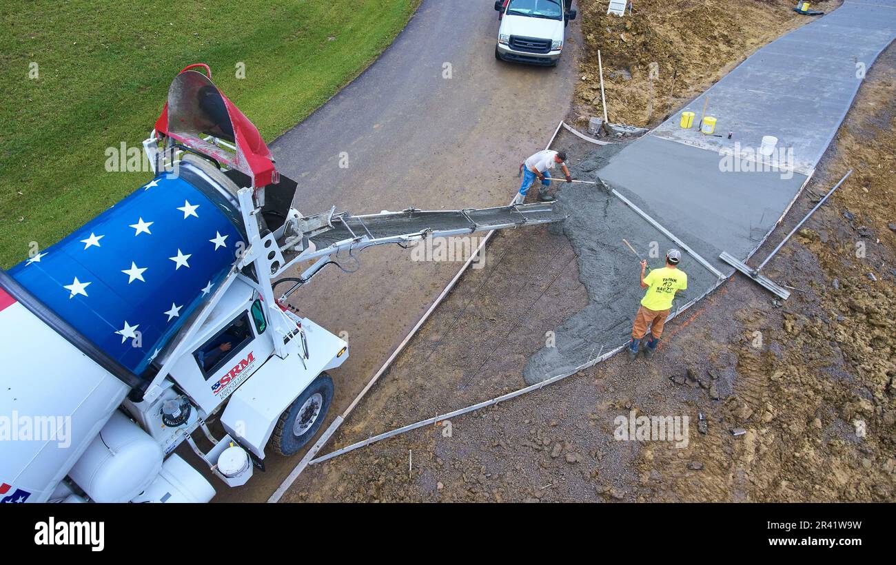 Construction cement truck driveway pour residential home area aerial ...