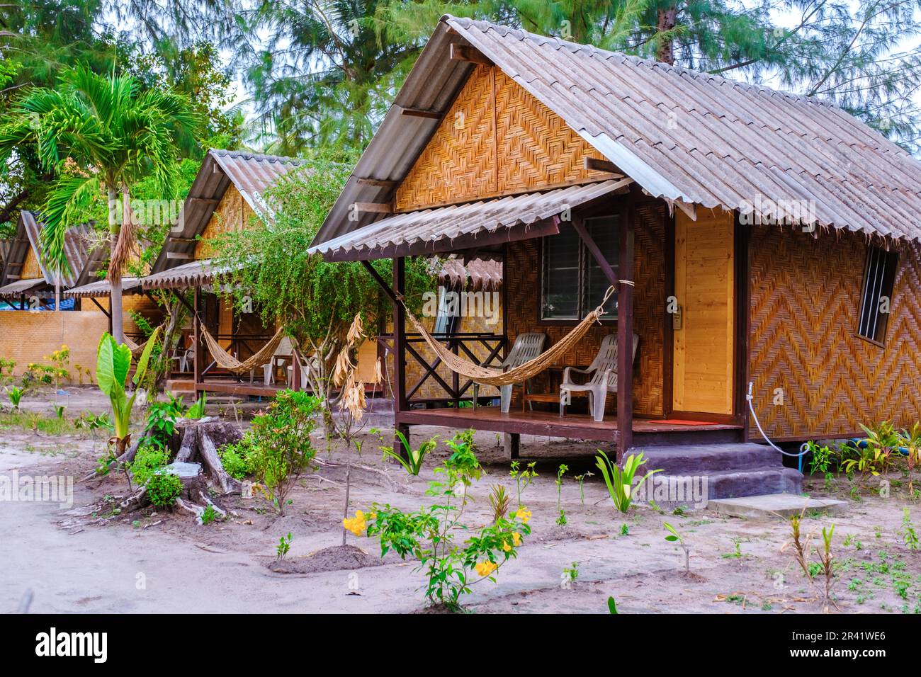 Bamboo hut bungalows on the beach in Thailand Stock Photo - Alamy