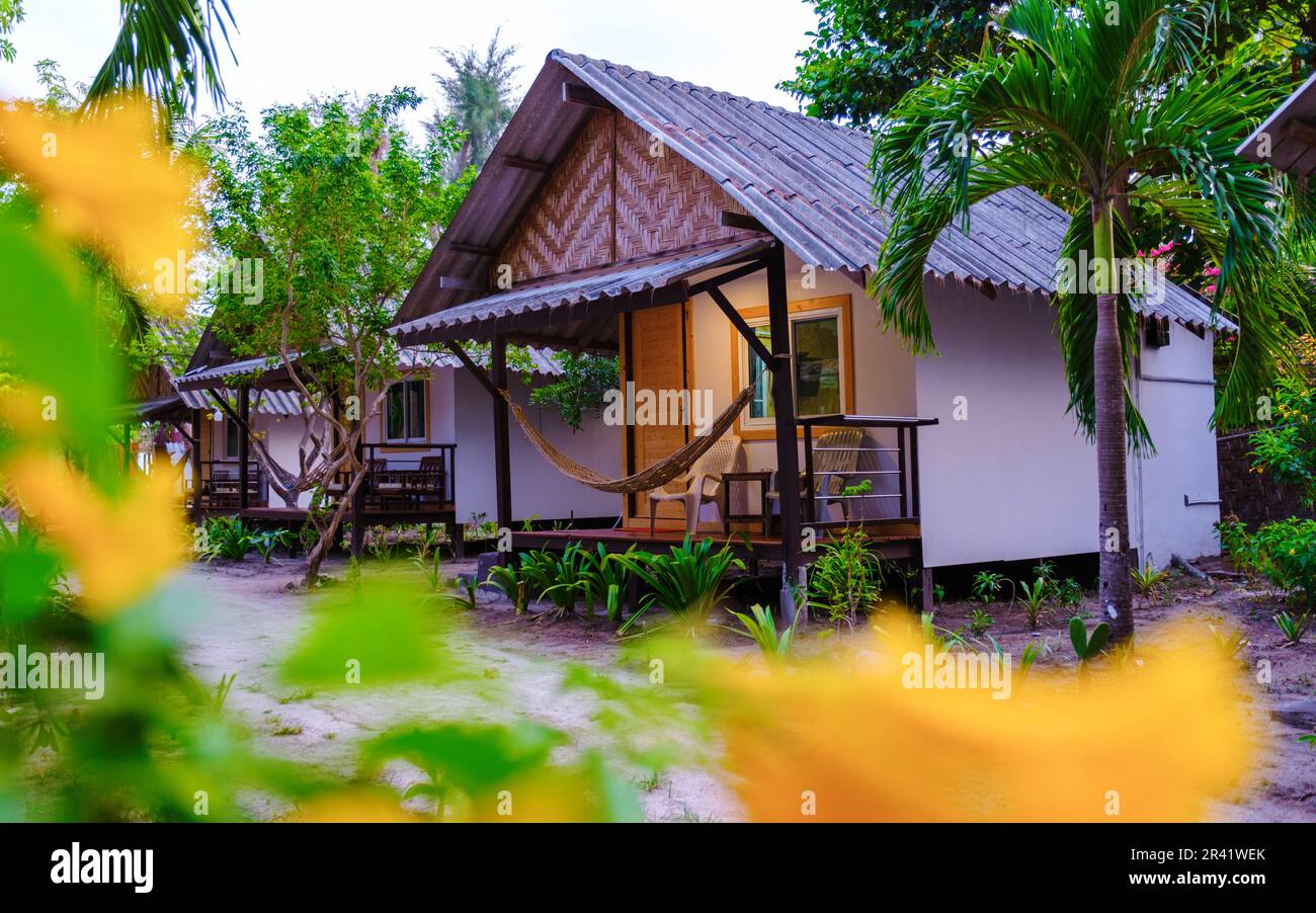 Bamboo hut bungalows on the beach in Thailand Stock Photo - Alamy