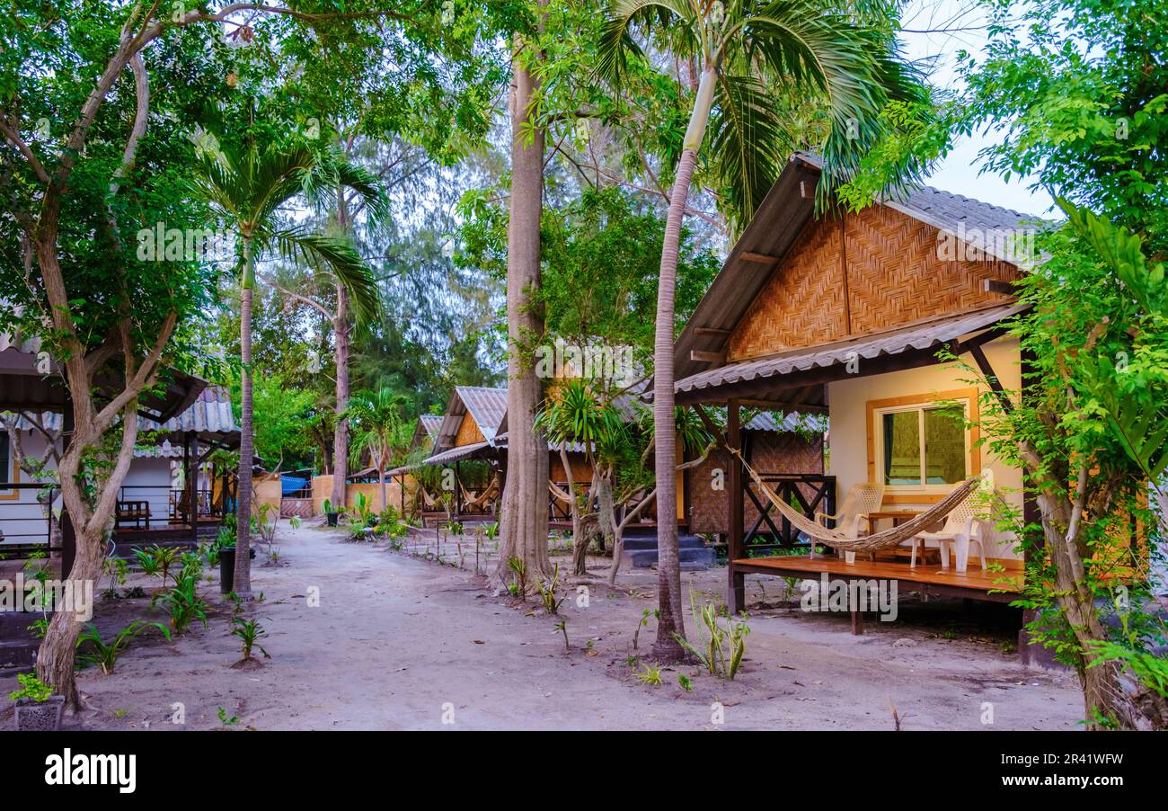 Bamboo hut bungalows on the beach in Thailand Stock Photo - Alamy
