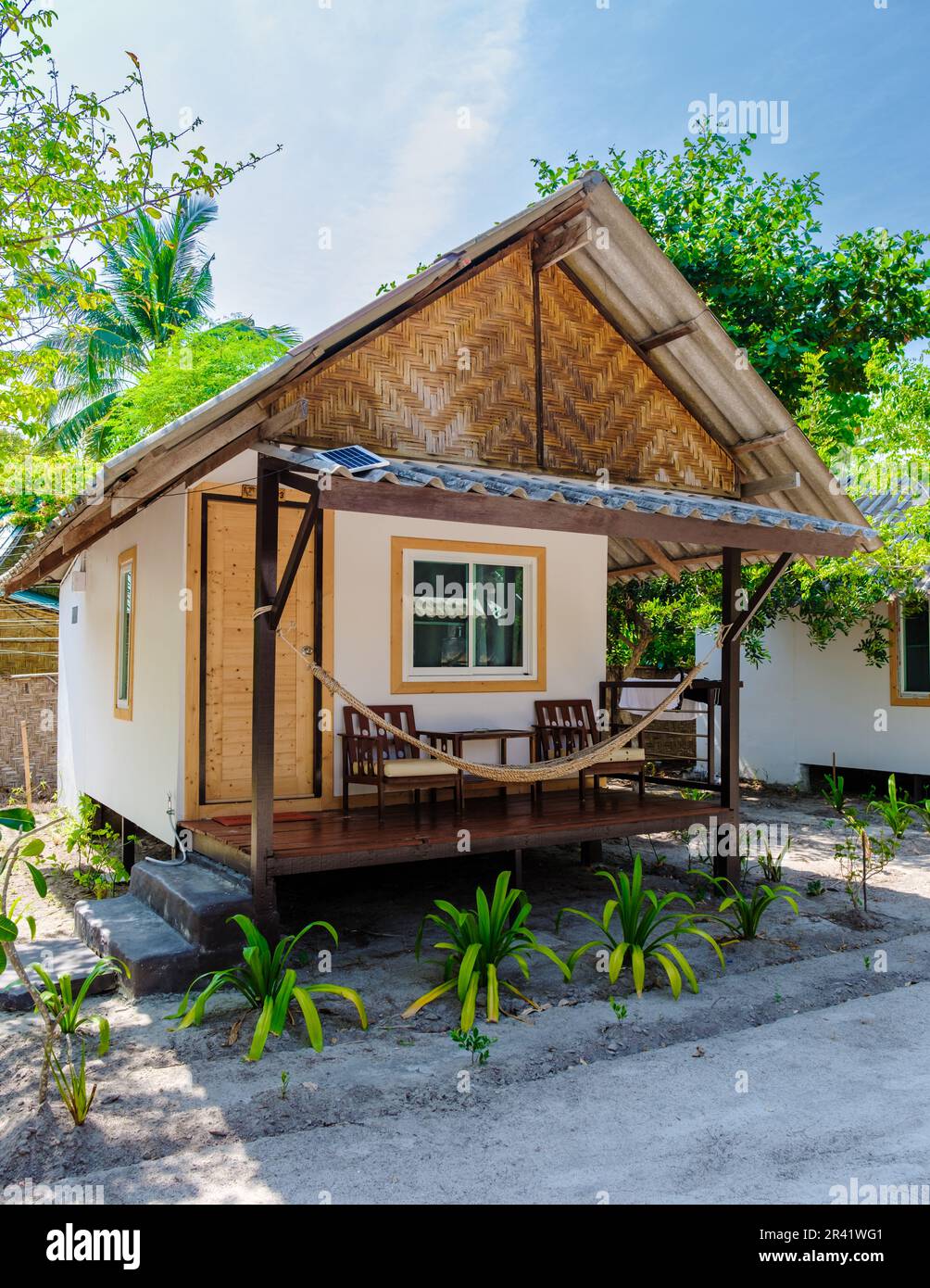 Bamboo hut bungalows on the beach in Thailand Stock Photo - Alamy