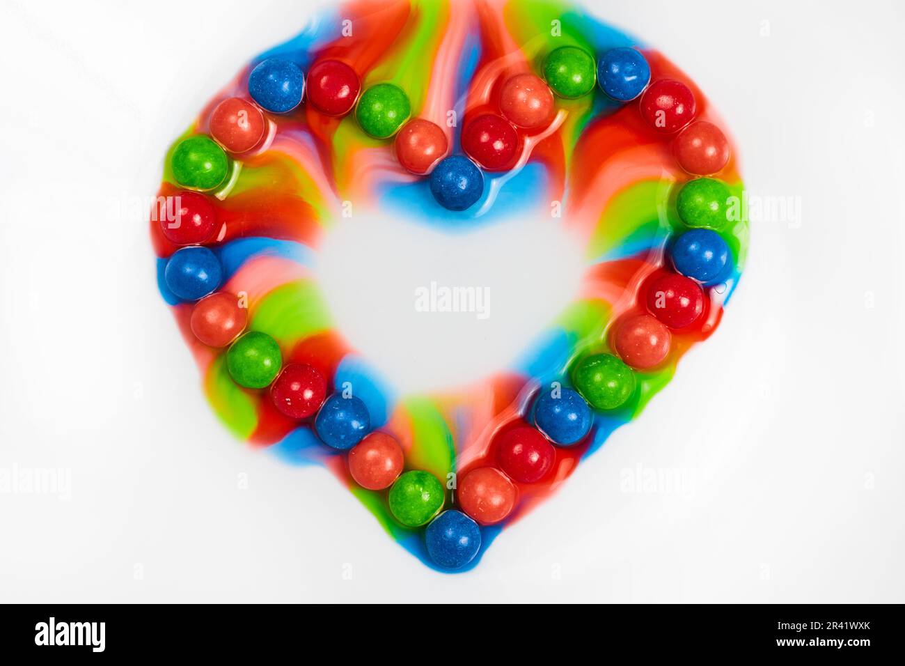 Bleeding Skittles Candy Heart Valentine Background Stock Photo - Alamy