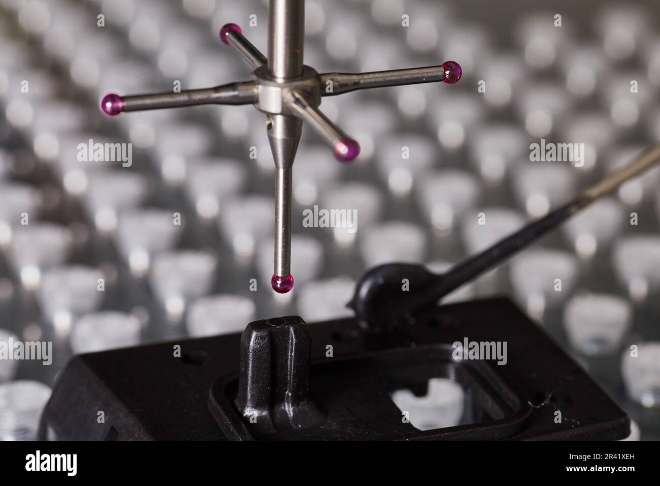Wall of blurred parts for CMM programming machine probe to scan for ...