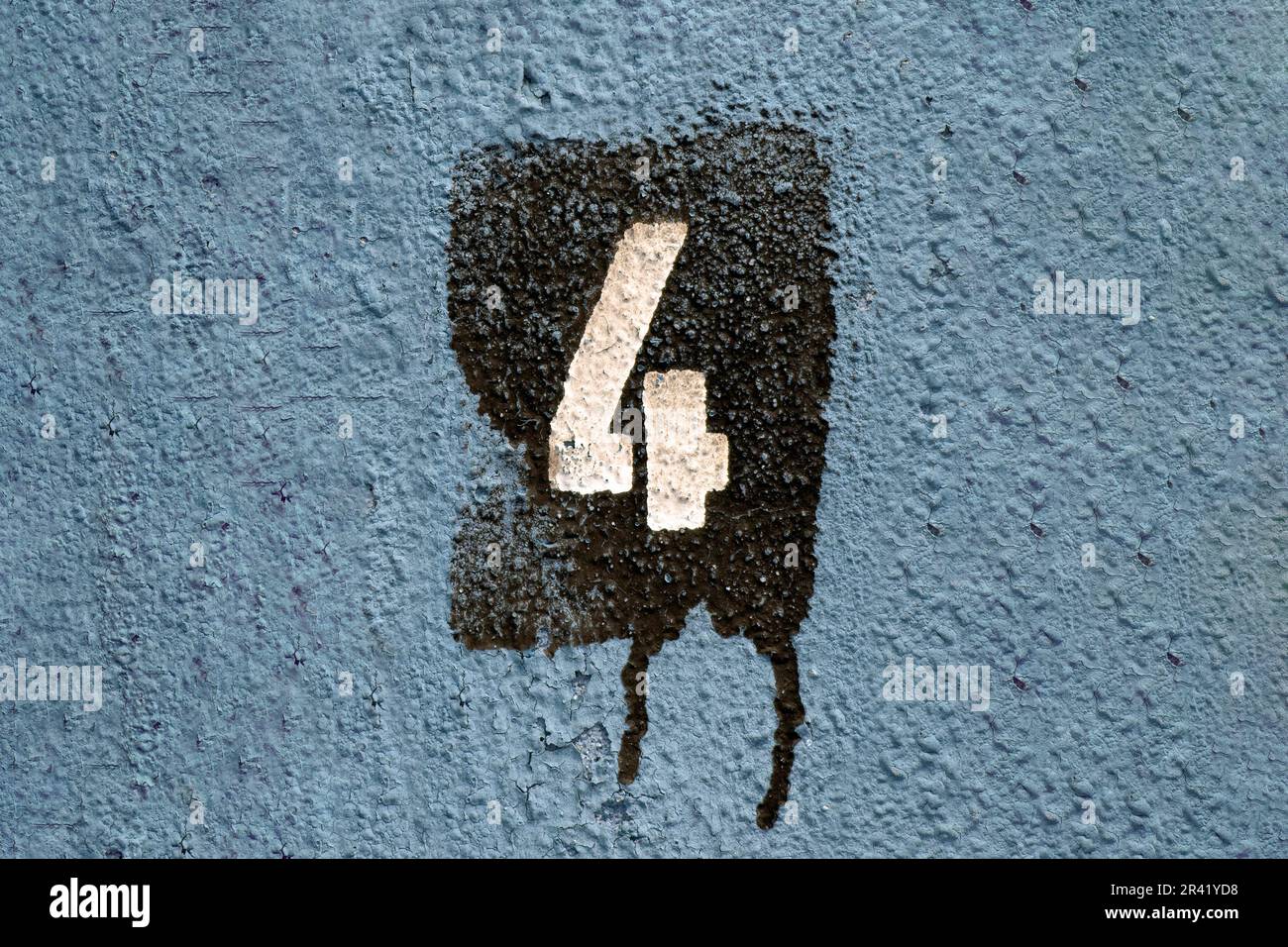 Number 4 Painted on a Textured Blue Wall with Dripping Paint Stock ...