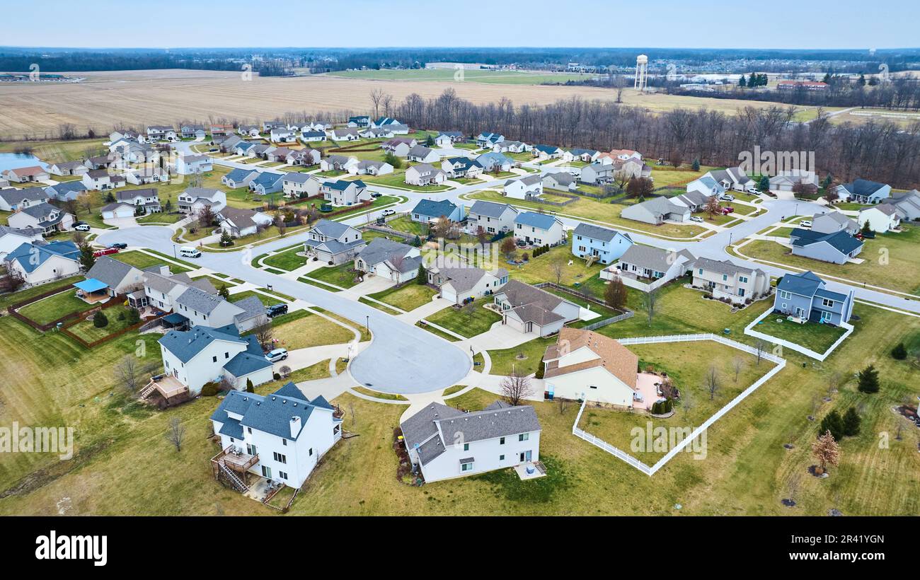 Drone aerial of suburban Midwest American neighborhood houses with ...