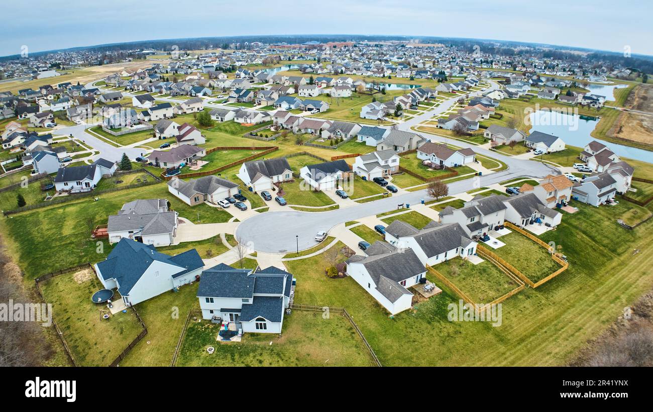 Drone aerial of Midwest American suburban neighborhood houses with ...