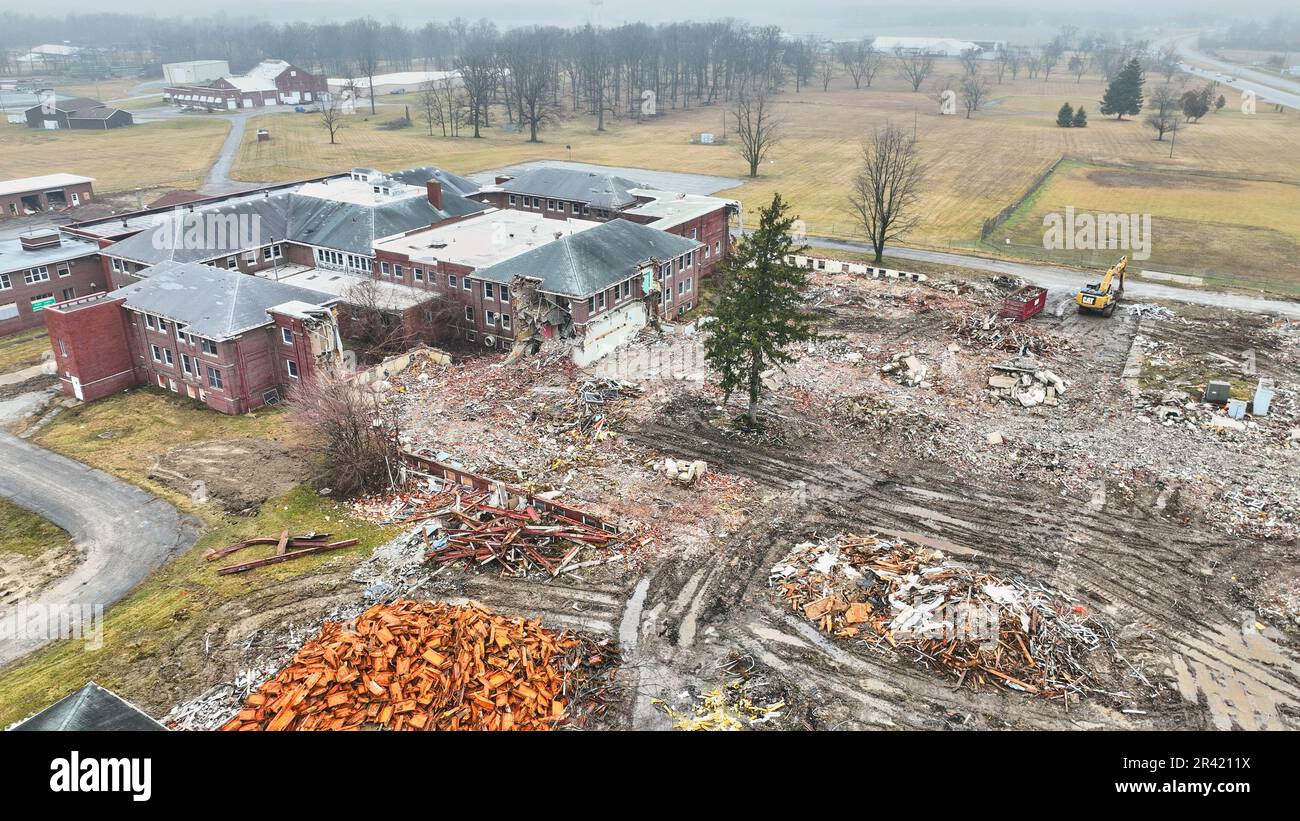 Deconstruction of abandoned hospital with drone and multiple scrap ...