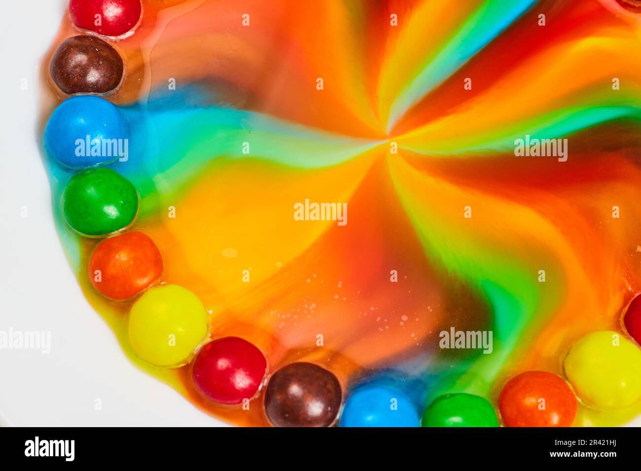 Psychedelic circular prism of color from candy skittles Stock Photo - Alamy