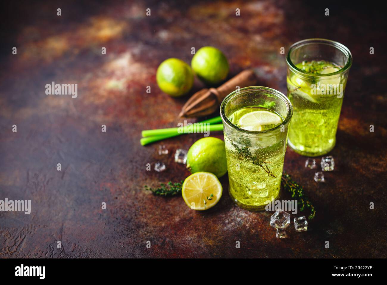 Lime Lemonade with thyme and ice Stock Photo - Alamy