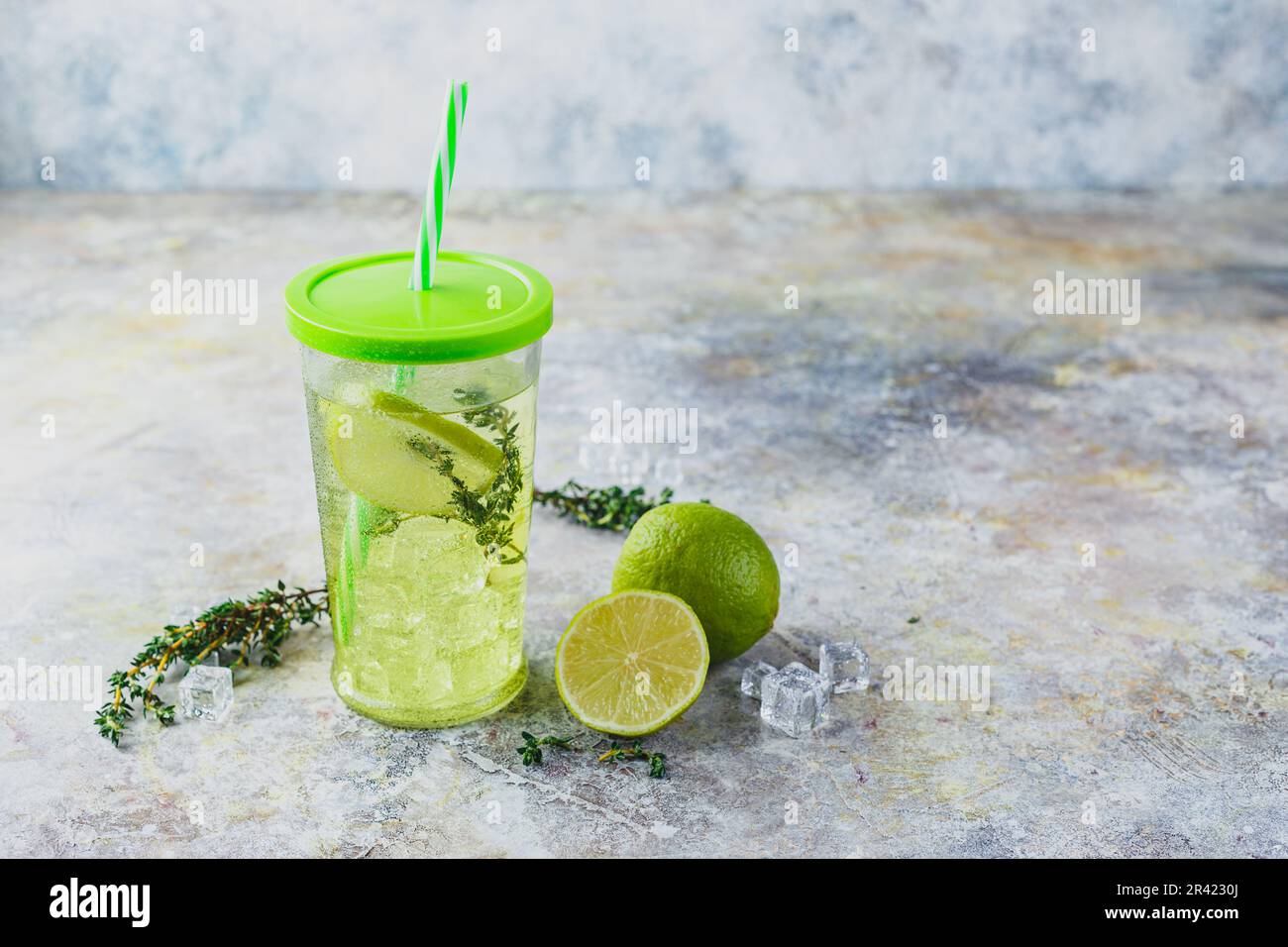 Lime Lemonade with thyme and ice Stock Photo - Alamy