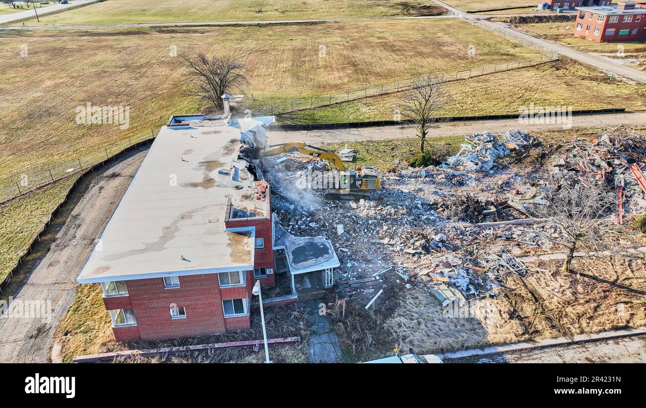 Drone aerial of large abandoned building being destroyed and demolished ...