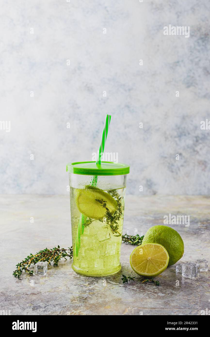 Lime Lemonade with thyme and ice Stock Photo - Alamy