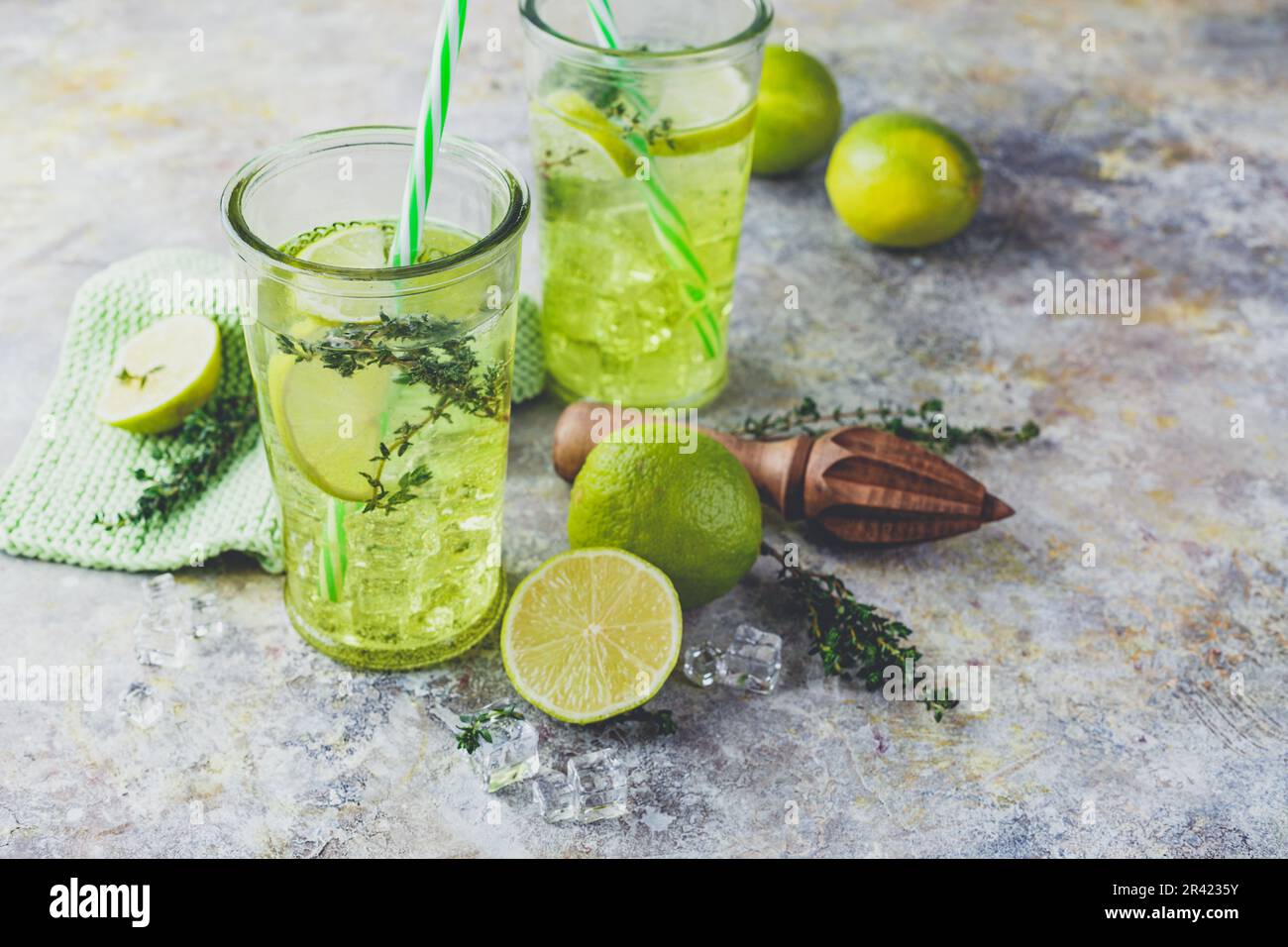 Lime Lemonade with thyme and ice Stock Photo - Alamy