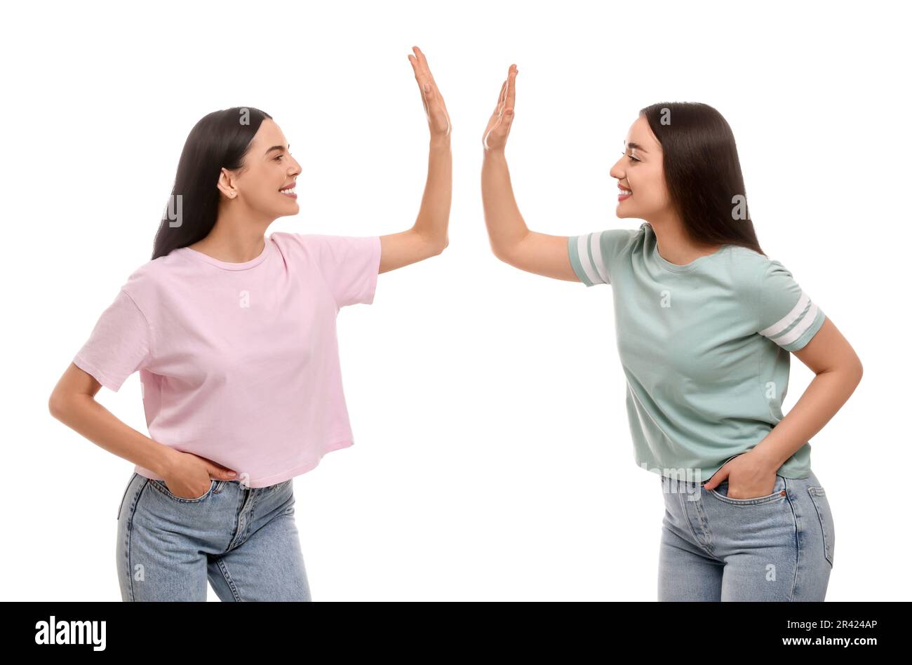 Women giving high five on white background Stock Photo - Alamy