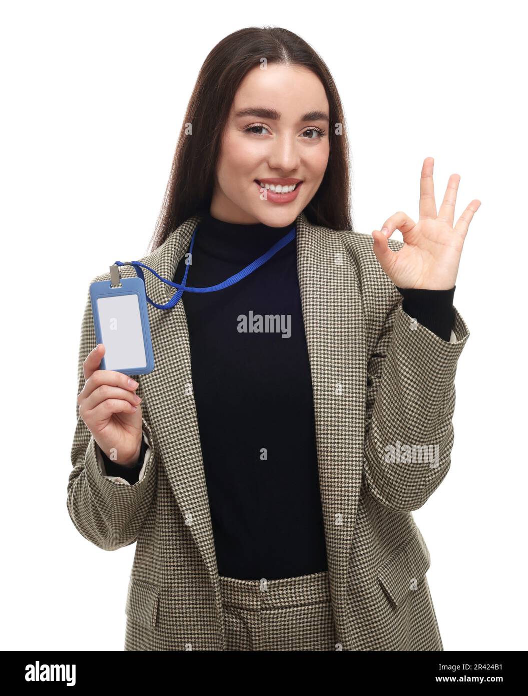 Happy woman with vip pass badge showing ok gesture on white background ...