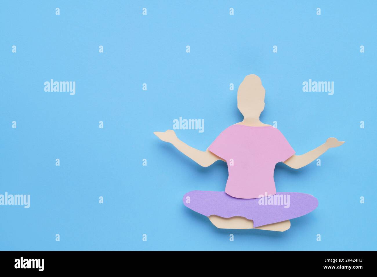 Woman`s health. Paper female figure on light blue background, top view ...