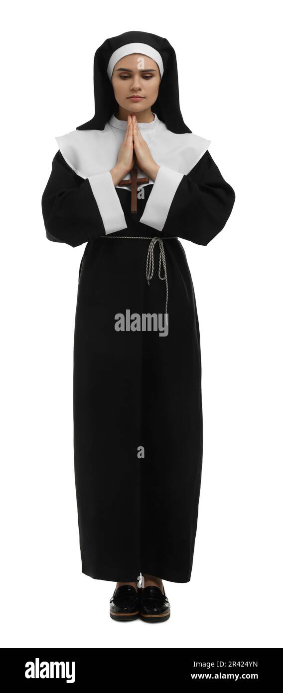 Nun with clasped hands praying to God on white background Stock Photo ...